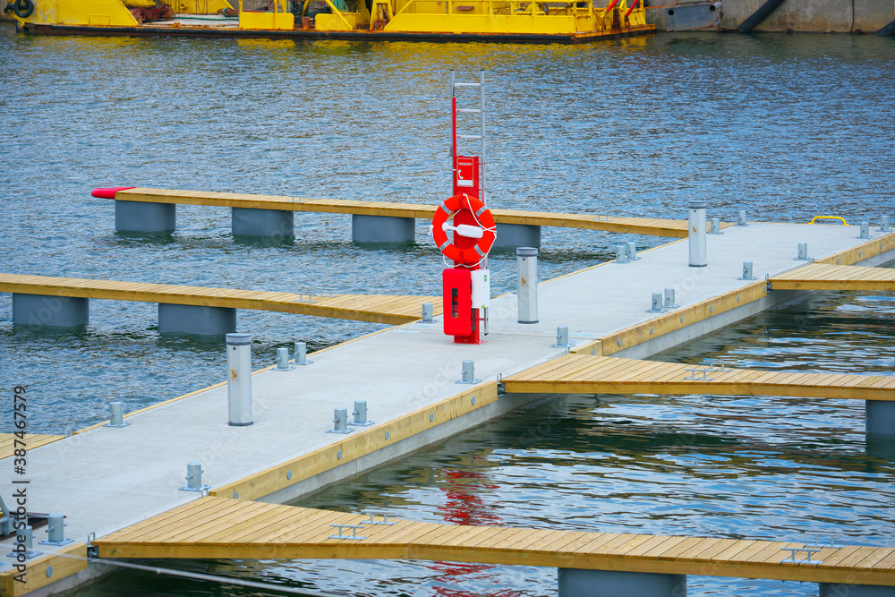 Safety equipment at the yacht berth. Lifebuoy, fire extinguisher ...
