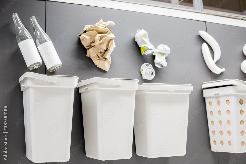 white Garbage cans for sorting garbage.Four decorative trash bins for ...