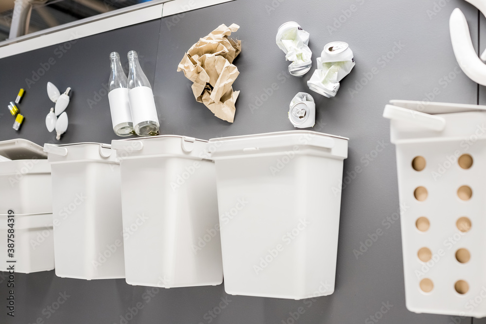 white Garbage cans for sorting garbage.Four decorative trash bins for ...