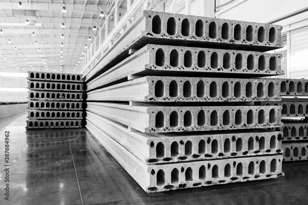 Poster Stack of precast reinforced concrete slabs in factory workshop ...