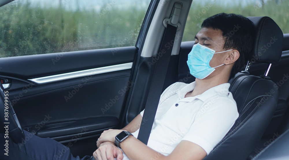 man sleeping in the car after a tired journey.inside driving car ...