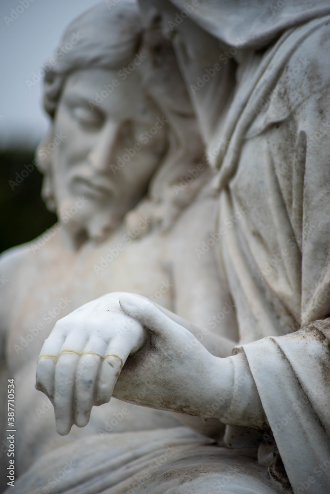 Mary holds Jesus's broken hand in a Victorian cemetery pieta, beautiful ...