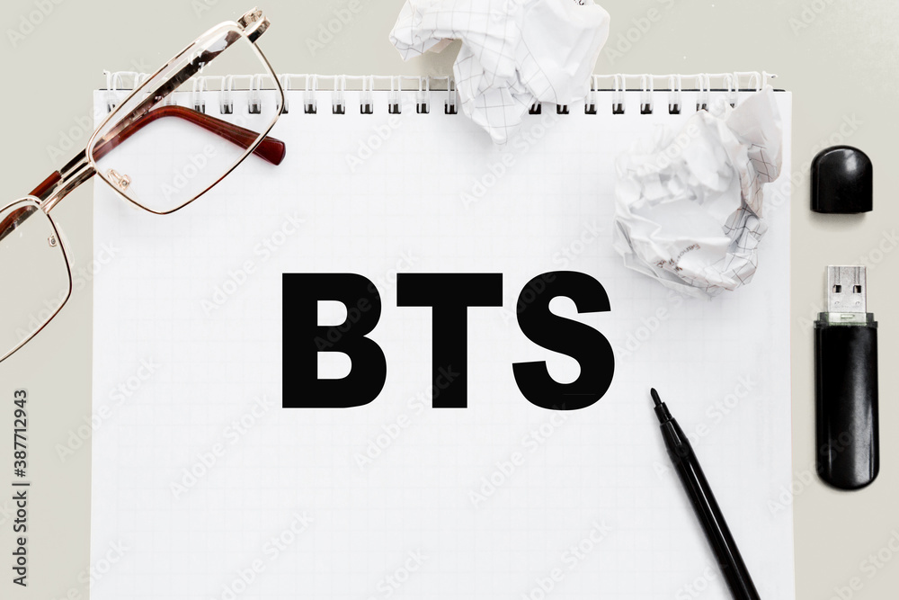 BTS word bts is note on a stack of paper. Grey background and marker ...