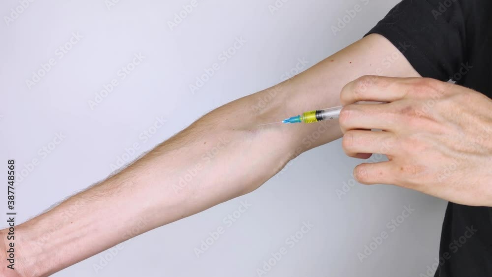 The Addict Makes Himself An Injection Of Prohibited Preparation Into The Veins Of The Forearm