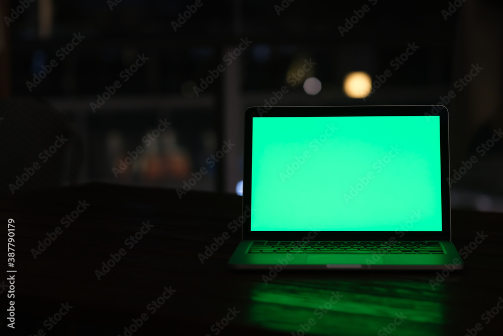front view of green screen laptop computer at dark night. Stock Photo ...