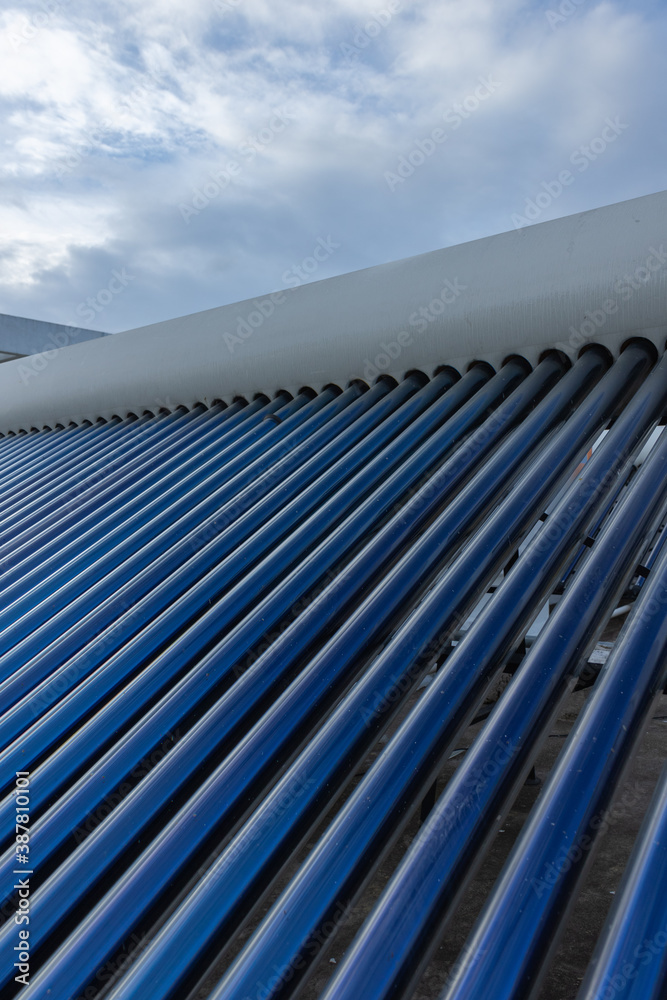 solar panels and tubes installed on roof top of houses and buildings to ...