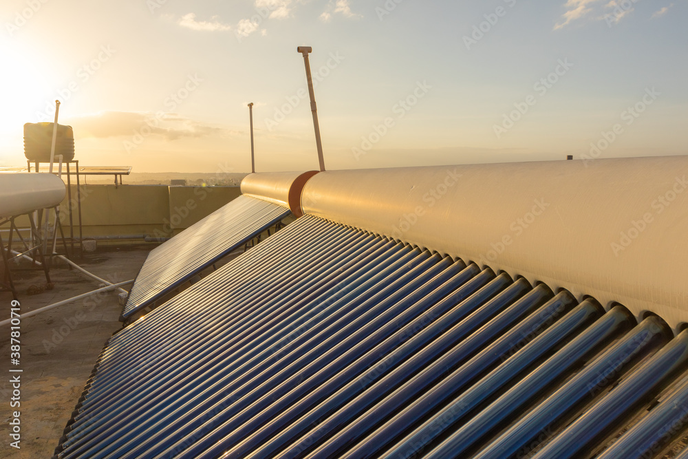 solar panels and tubes installed on roof top of houses and buildings to ...