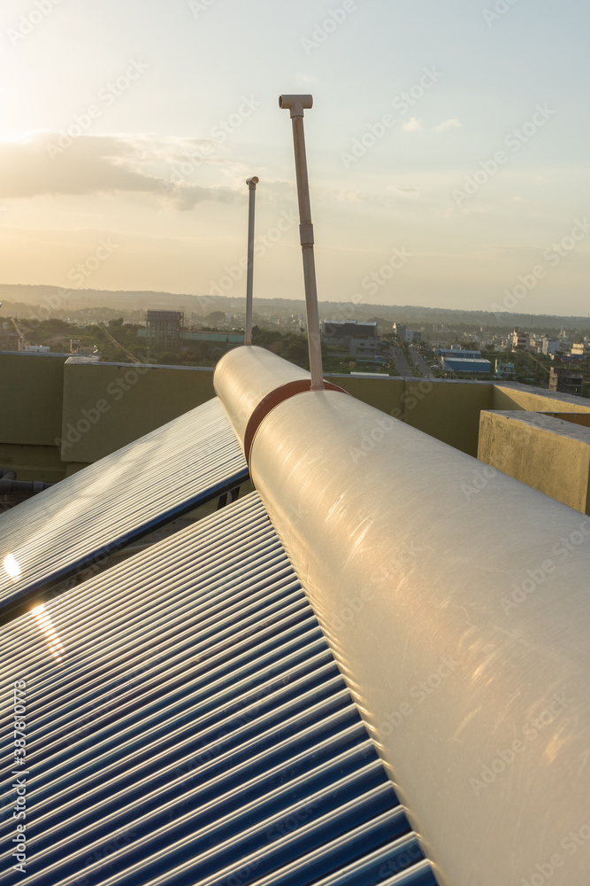solar panels and tubes installed on roof top of houses and buildings to ...