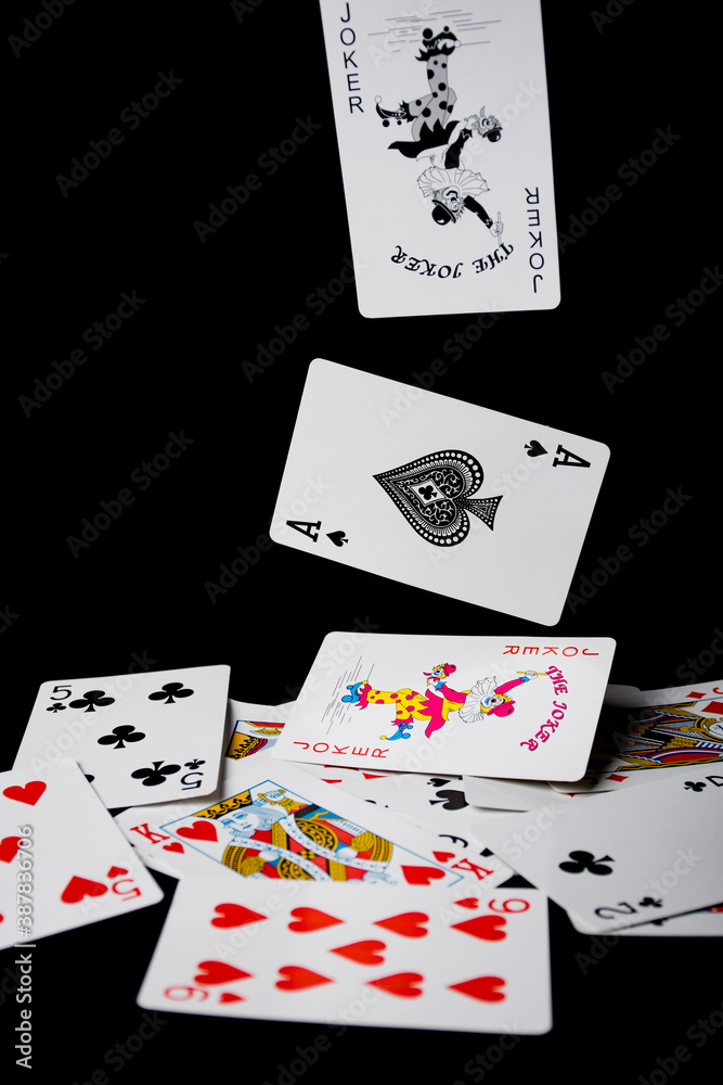 Poker falling cards on black background: aces, joker and others. Cards ...