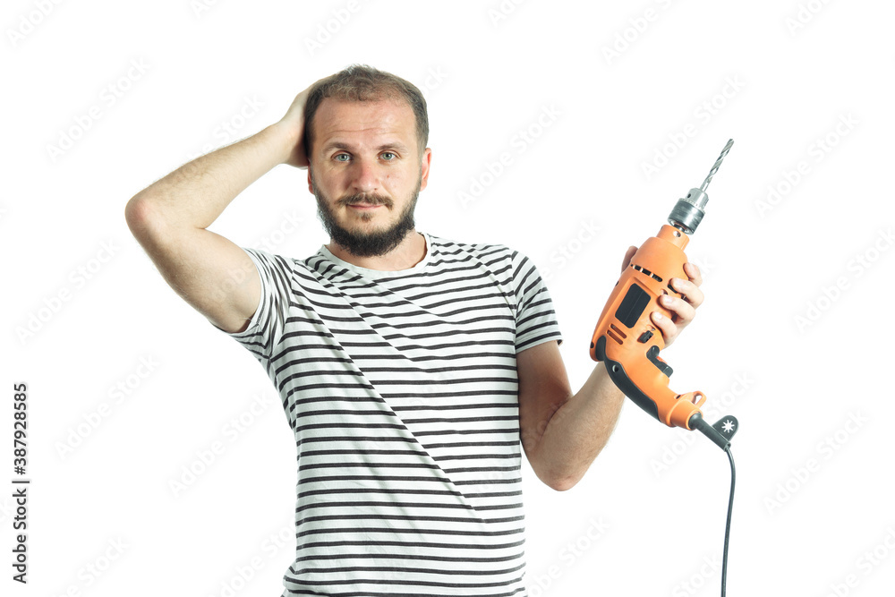 Perplexity builder handy man is hold a power tool - electic drill or ...
