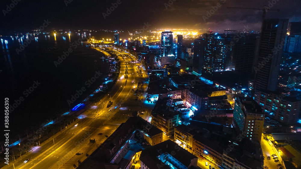 Road, lights and sea at night. Luanda city captured from the top Stock ...