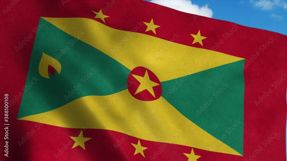 The national flag of Grenada waving in the wind, blue sky background ...
