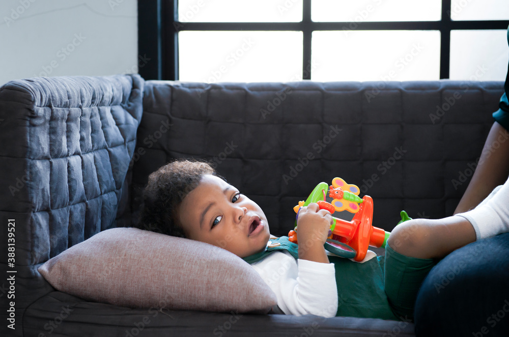 African American baby boy with pacifier is interesting his favorite ...