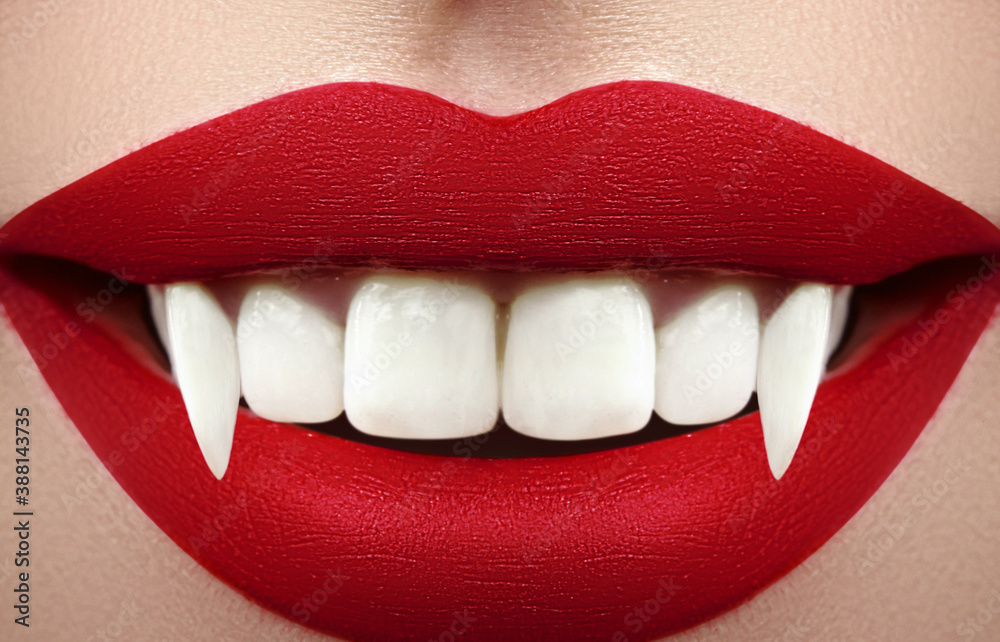 Sexy female vampire lips. Halloween background with red blood makeup lip. Masquerade look with ...