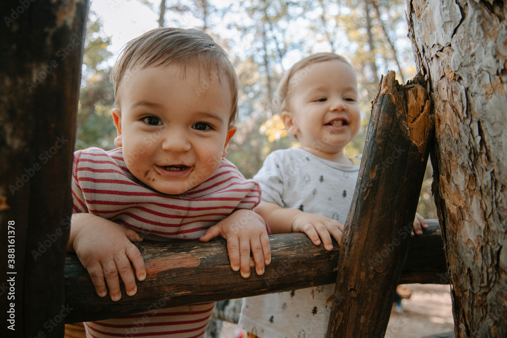 Kids playing in the woods Stock Photo | Adobe Stock