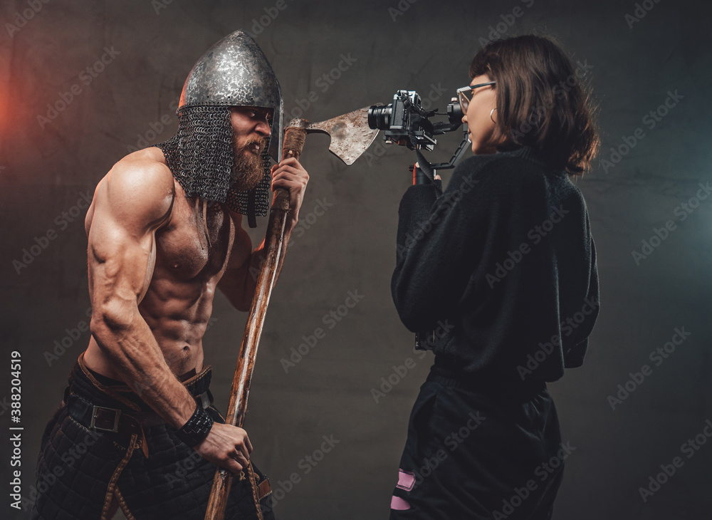 Shirtless and muscular guy with axe and helmet in fashion of savage ...