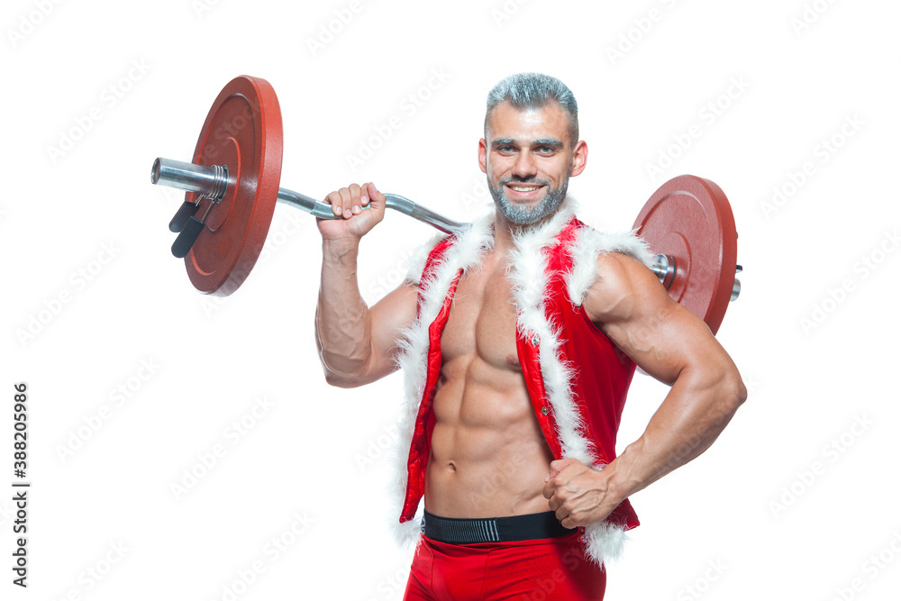Sexy Santa Claus. Bodybuilder young handsome santa clause smile holds a ...