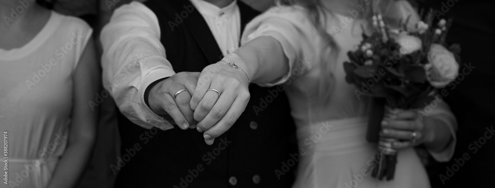Two hands with wedding rings on wedding day, two hands with the rings ...