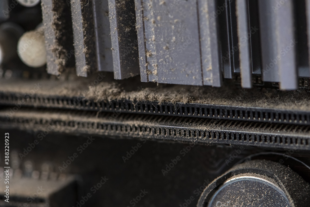 Dust and dirt on the computer's motherboard. Concept: old hardware ...