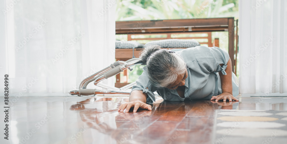 Asian senior woman falling down on lying floor at home after Stumbled ...