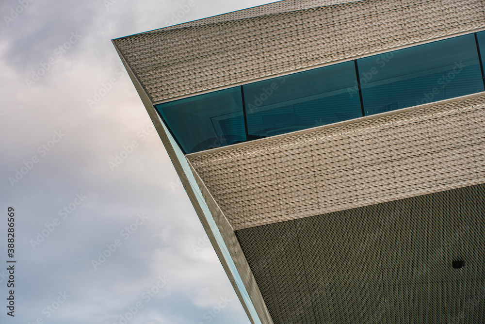 A detailed edge of a contemporary building facade conveys a sense of ...