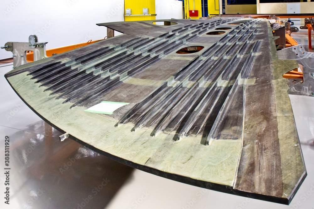 Assembling the airplane. A closeup of part of the plane - wing - in the ...