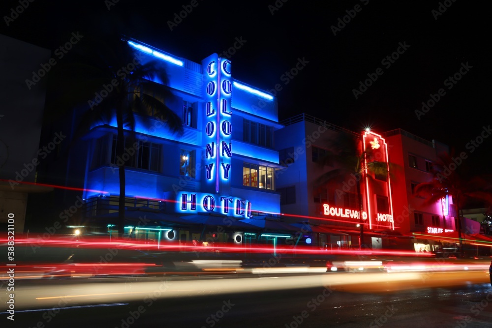 The Colony and the Boulevard hotels are lit up in red and blue neon on ...