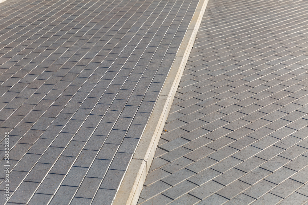 view of the paving stones and curb in front of the office building ...