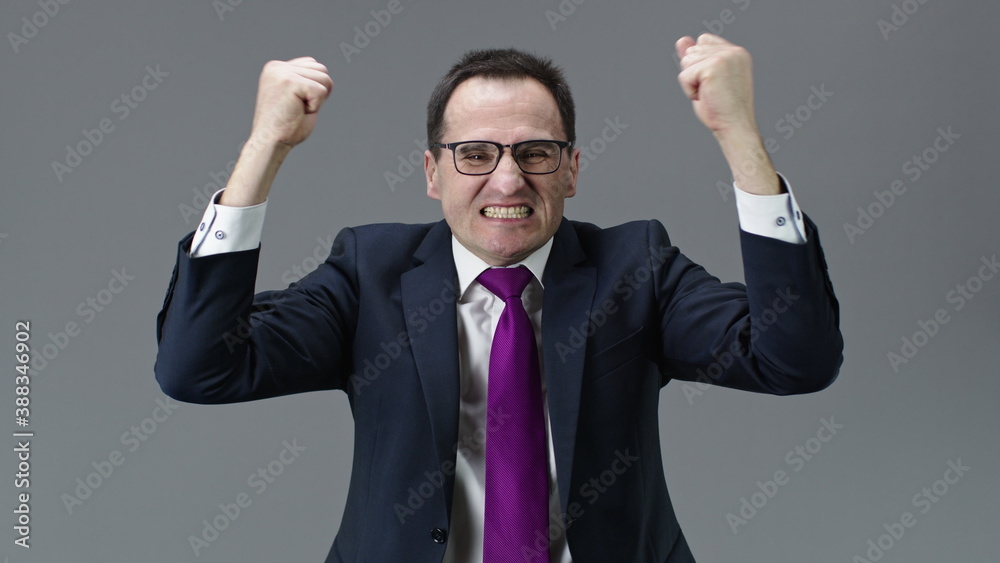 Furious, angry middle aged businessman in formal clothes, tie and ...