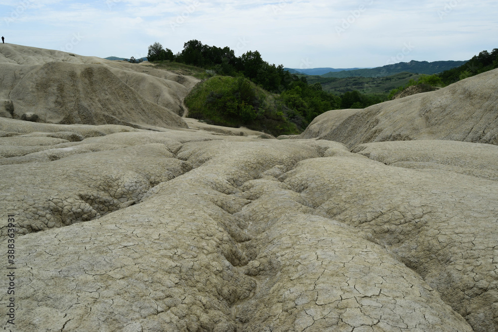Undulated water canal in dry soil texture. The Berca Mud Volcanoes is a ...