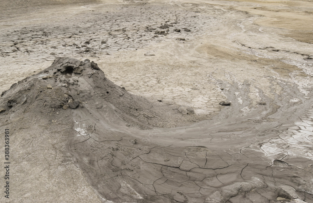 Mud liquid flowing from mud volcano, at Paclele Mari mud volcanoes in ...