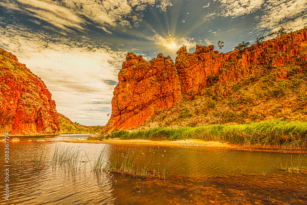 Outback landscape with red rocks and Finke river passage at Glen Helen ...