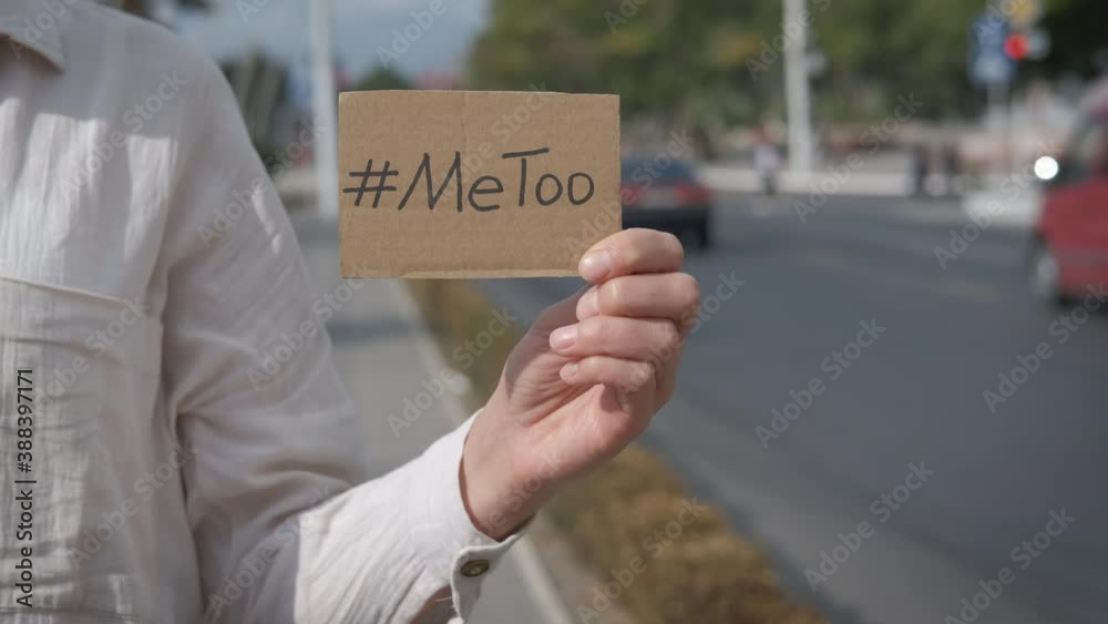 Stop harassment. A view of a woman's hand with a metoo slogan on the ...