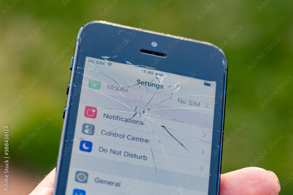 Sydney, Australia 2019-09-13 Hand holding working smartphone with badly ...