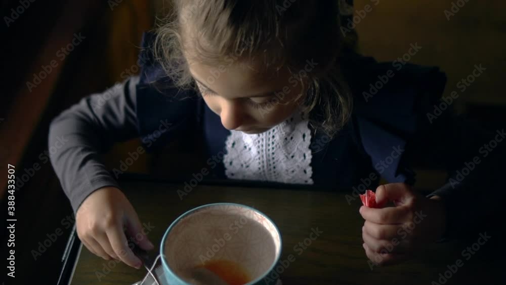 School girl with sad face. Little girl in school uniform at lunch ...