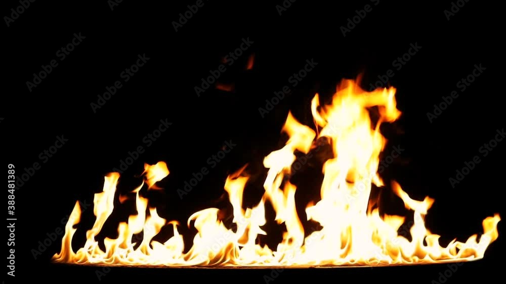 Closeup shot of the Huge line of flames rising from lower edge and ...