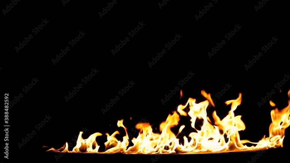 Huge line of flames rising from lower edge and swelling up by wind ...