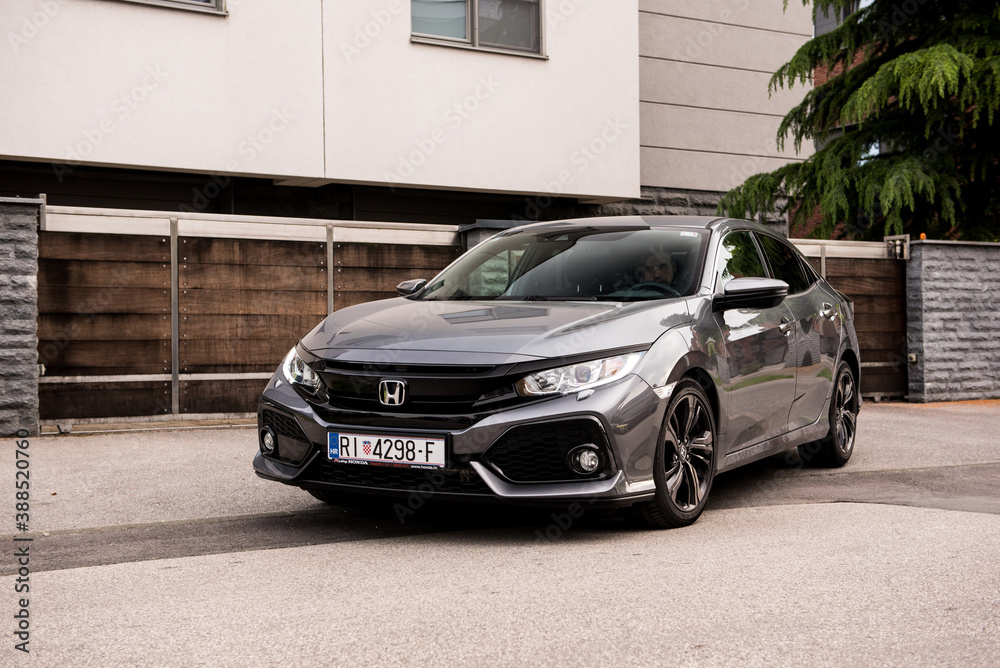 New Honda Civic in grey colour in front of the house. New Honda model ...