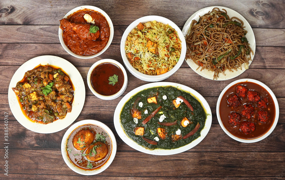 Assorted indian food on wooden background. Paneer biryani,palak paneer ...