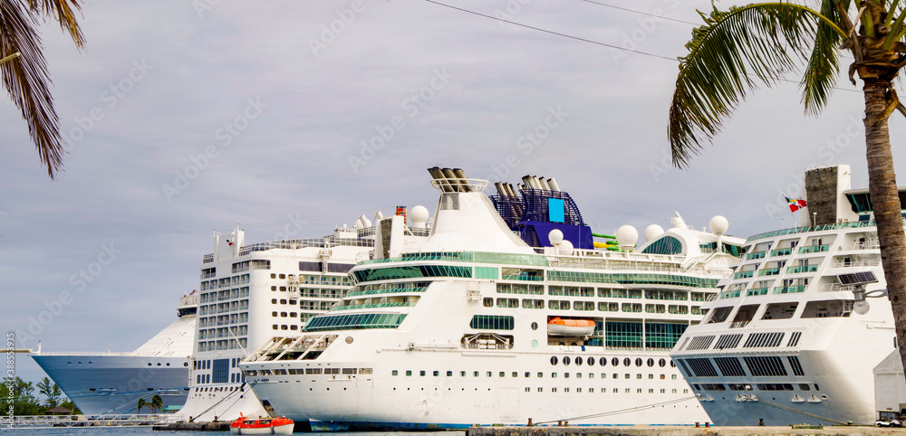 Huge and modern cruiseships or cruise ship liners line up in port of ...