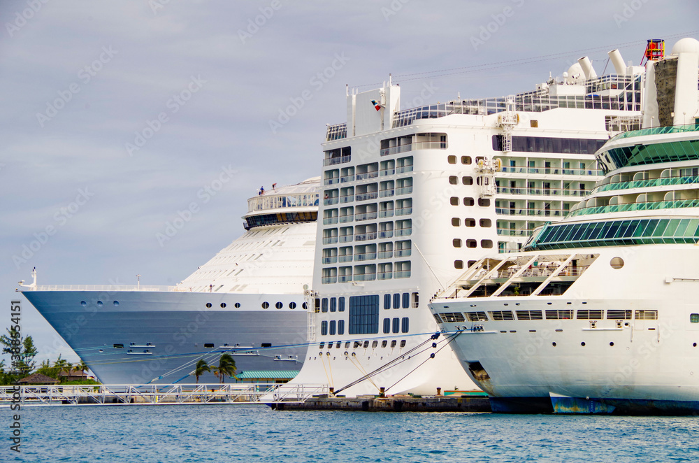 Huge and modern cruiseships or cruise ship liners line up in port of ...