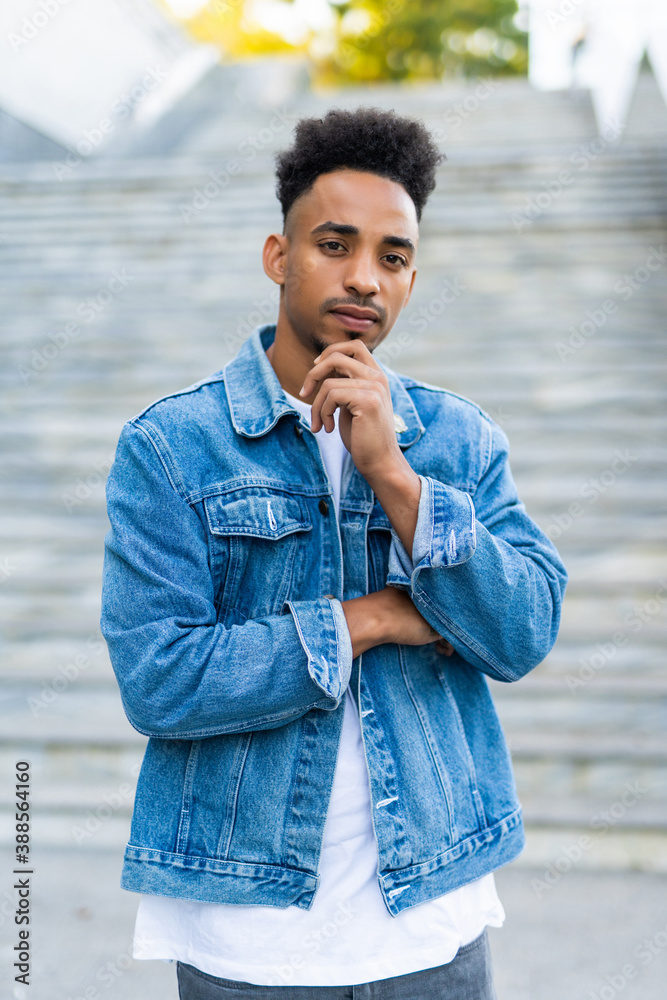 African American college student man wear in jeans jacket standing in ...