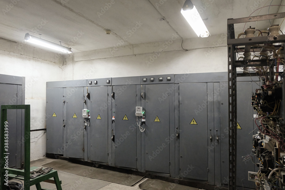 Switchboard room with metal electrical cupboards and contact-breakers ...