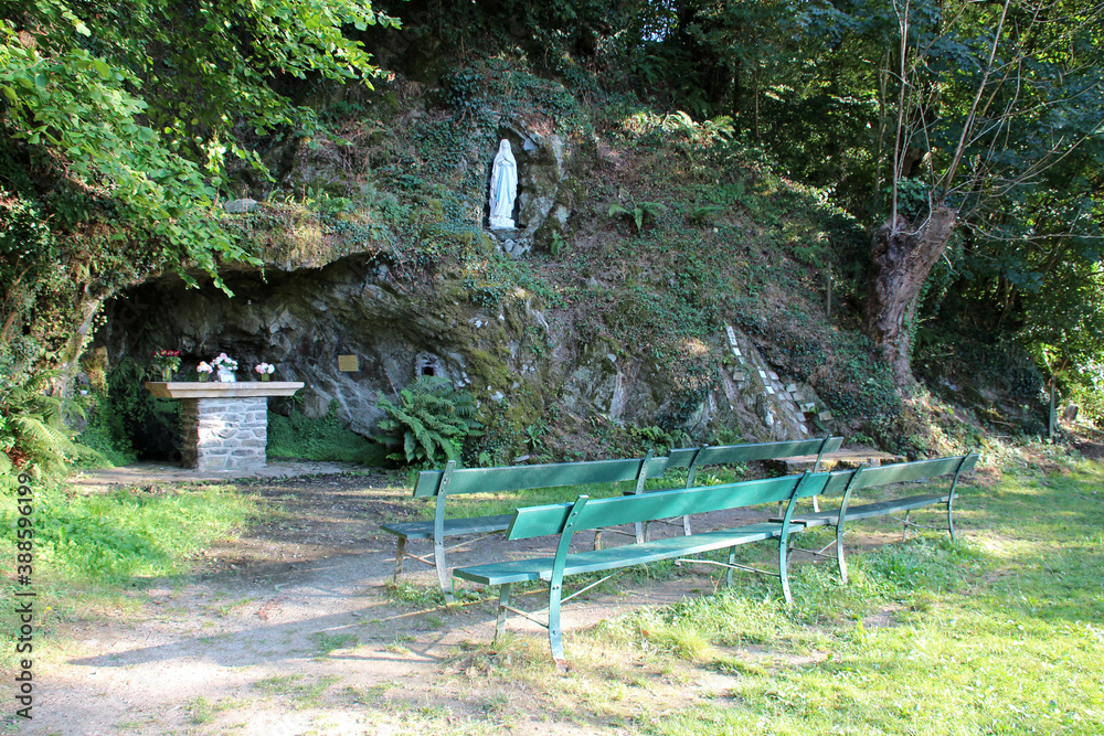 cave with catholic altar and the statue of our lady in vouvant in ...