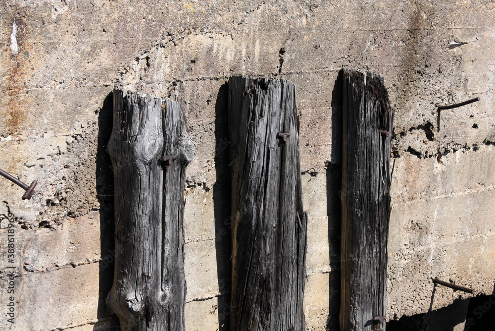 Old logs bumpers on a concrete pier Stock 写真 | Adobe Stock