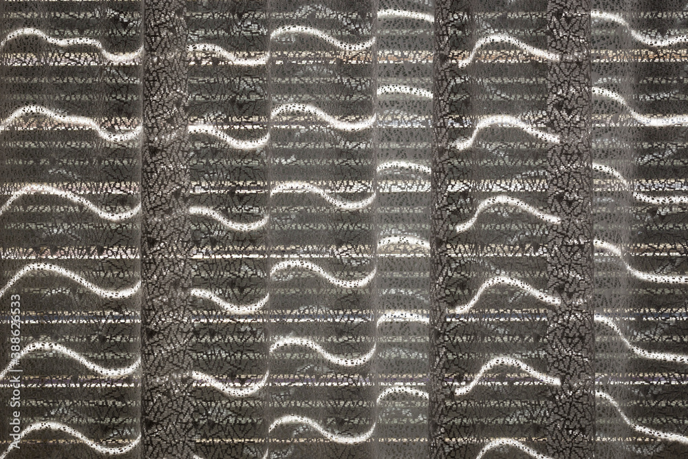 texture of a fabric. curvy light patterns of sunlight on the old net ...