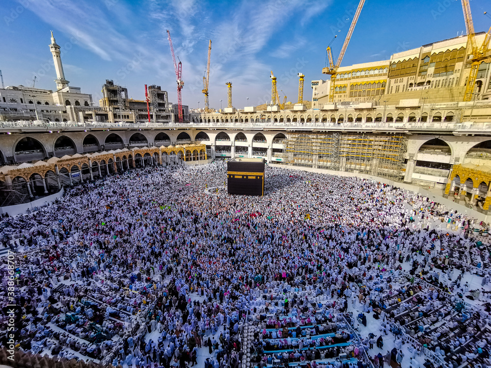 Muslim pilgrims from all around the World revolving around the Kaaba in ...