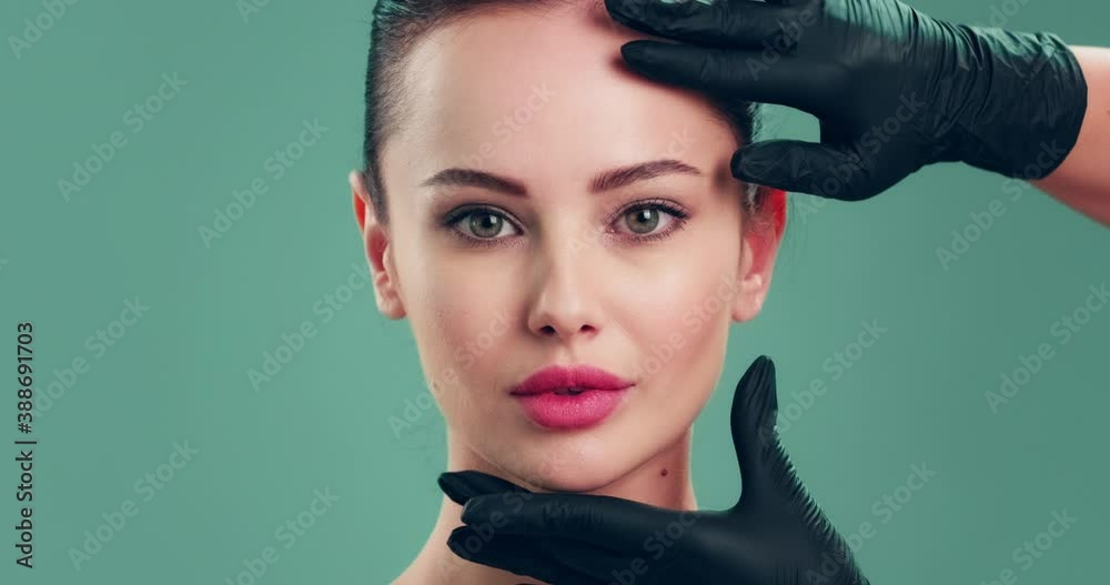 Slow motion clip - Doctor checks a skin before plastic surgery. Face ...