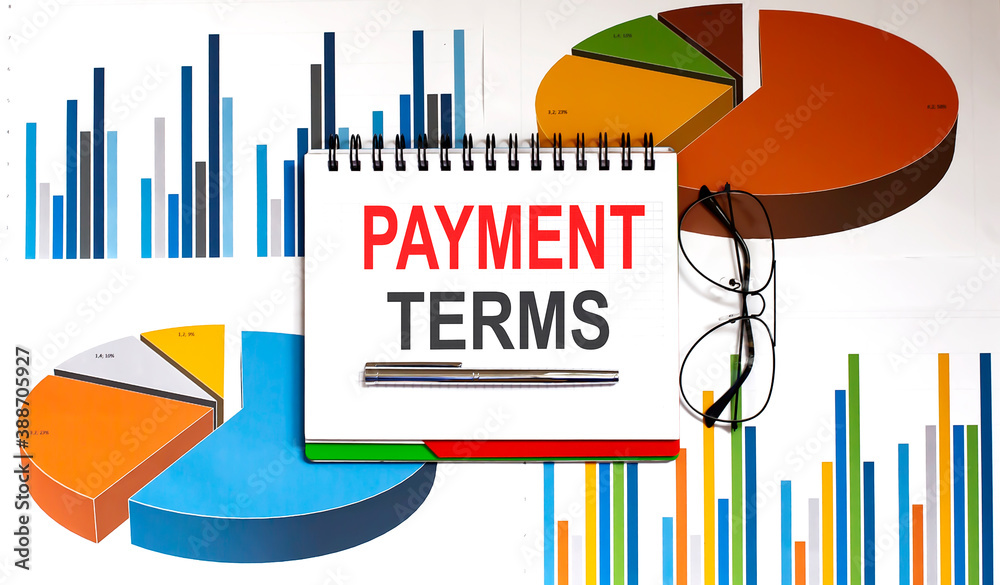 PAYMENT TERMS .Conceptual background with charts and papers and glasses ...