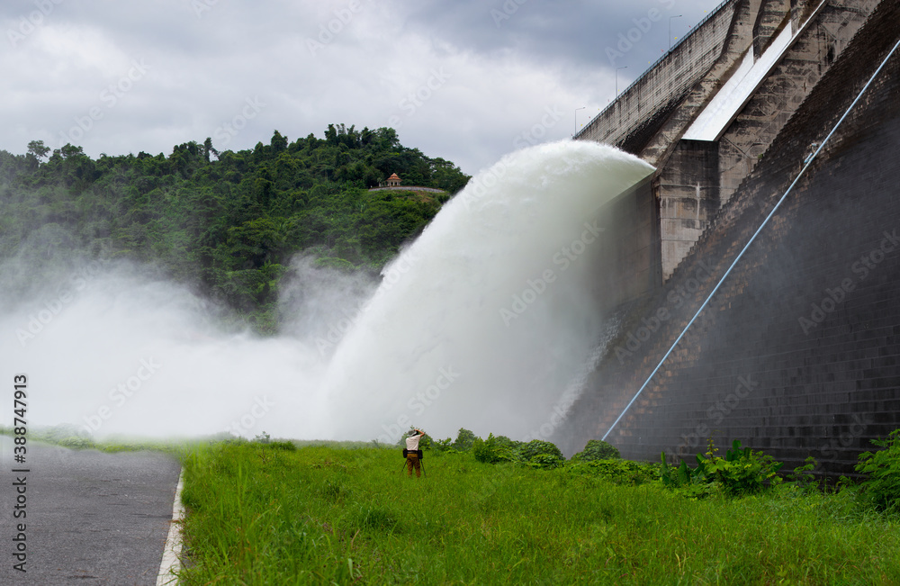 Water falling from the spillway of the concrete dam, it is overflow way ...